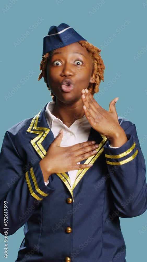 Vertical video: Female aircrew member showing surprised reaction, being ...