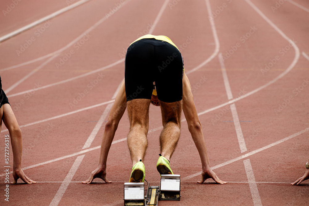runners sprinters in starting blocks on SET command Stock Photo | Adobe ...
