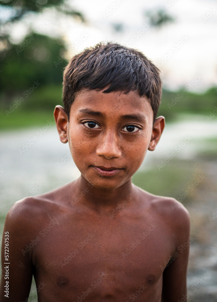 Portrait of a south asian teenage village boy , shirtless rural kid ...