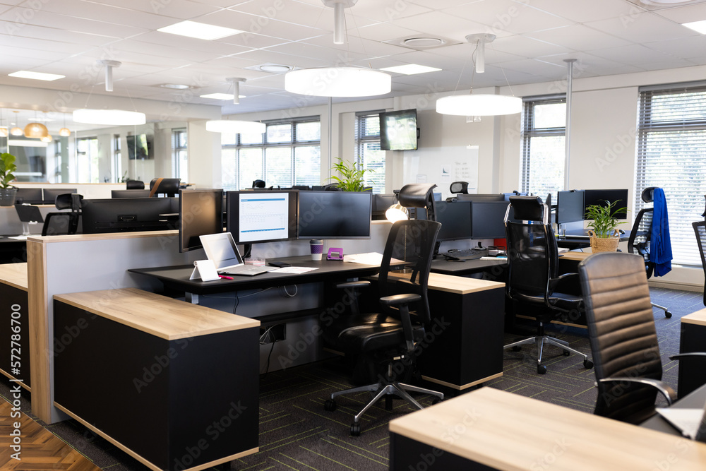 Empty open space office with desks, chairs and computers Stock Photo ...