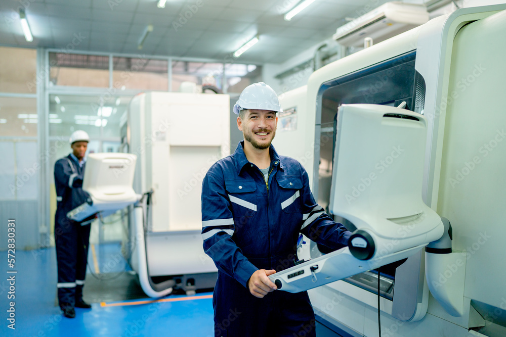 Caucasian worker and African American technician shake hand with ...