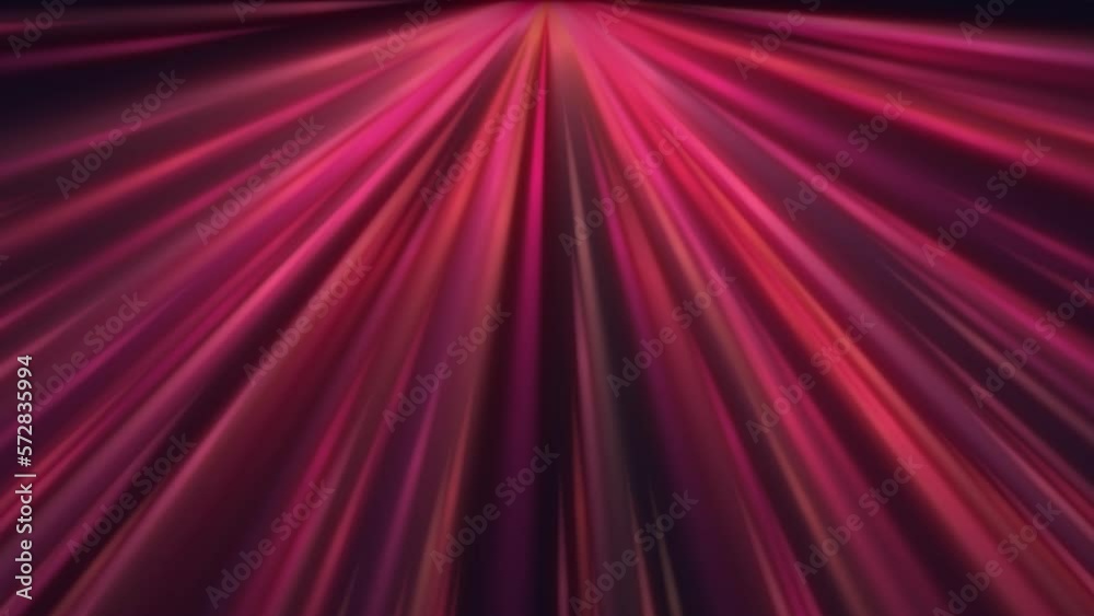 Colorful rays of red light radiating from the top of the frame in a ...