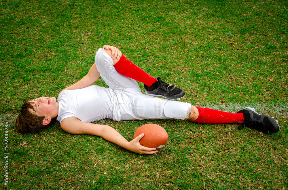 Youth Preteen Boy Football Player Injured on the Field Stock Photo ...