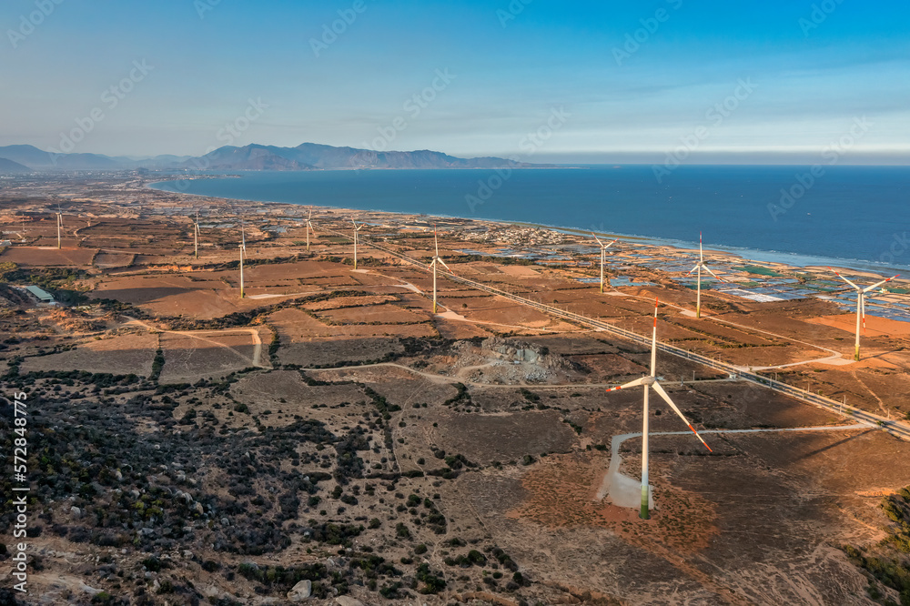 Panoramic view of wind farm or wind park, with high wind turbines for ...