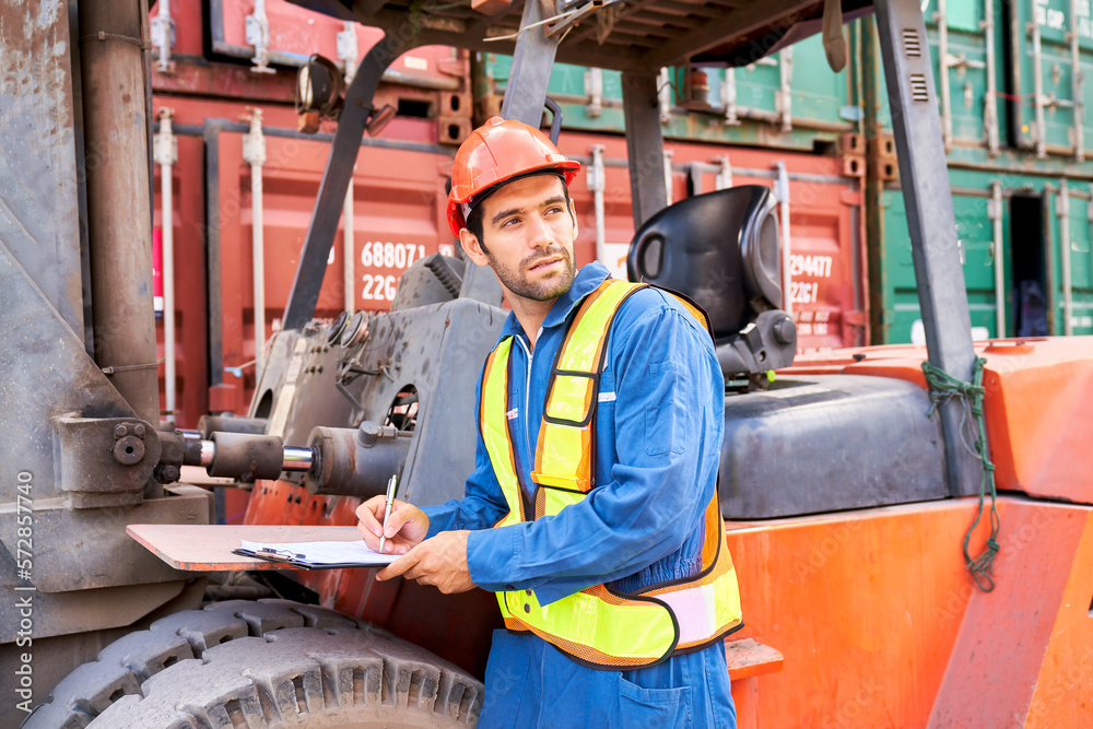 Smart foreman in safety suit lecture to checking stock on paper chart ...