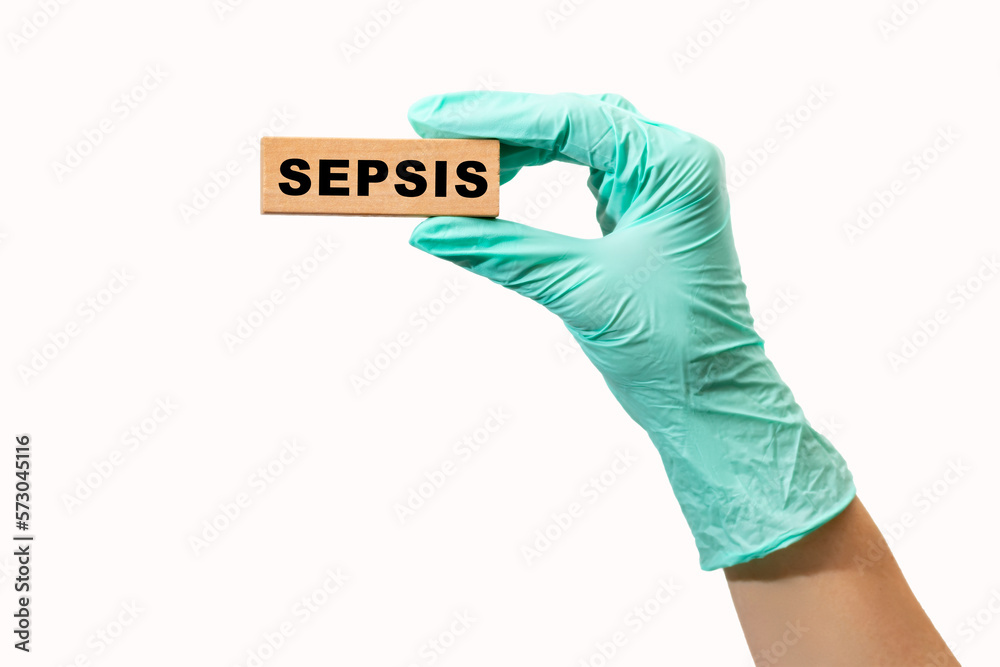 Hand in blue glove with wood card. Concept word 'sepsis'. Medical ...