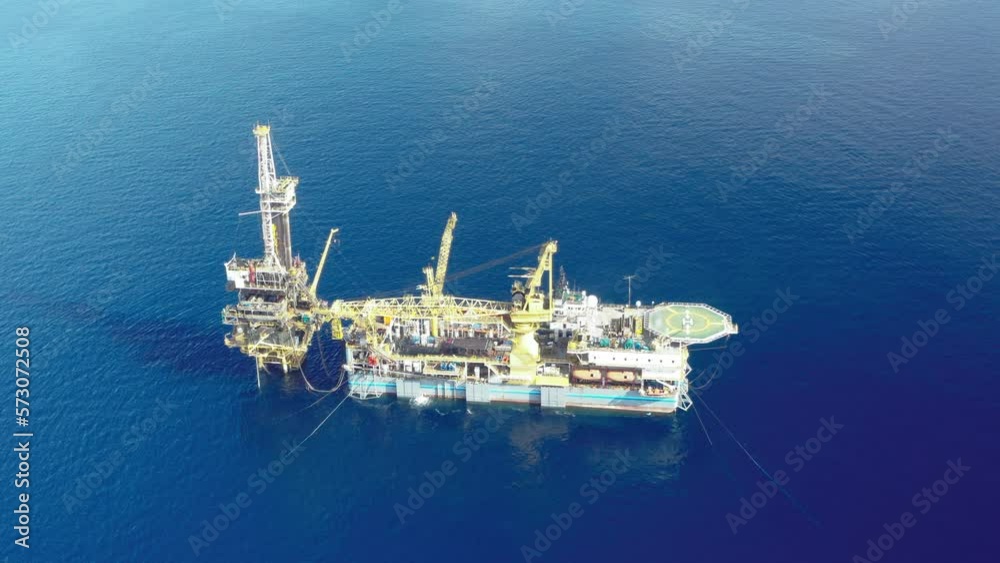 An aerial view from a drone of a tender drilling oil rig (Barge Oil Rig ...