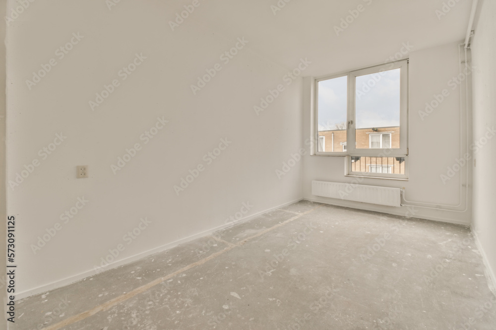 an empty room with white walls and no one person standing in the corner ...