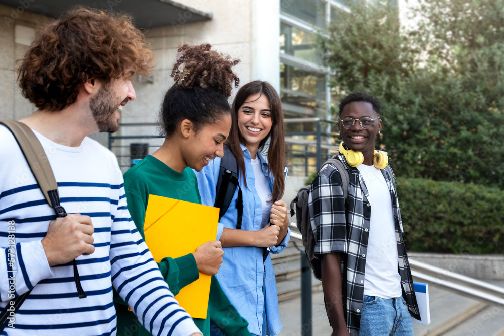 College friends walk to class together. Multiracial university students ... College friends walk to class together. Multiracial university students ...