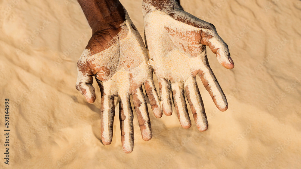 Climate change. Man holding sand in his hands. Symbolic representation ...
