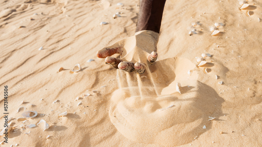 Climate change. Man holding sand in his hand. Symbolic representation ...
