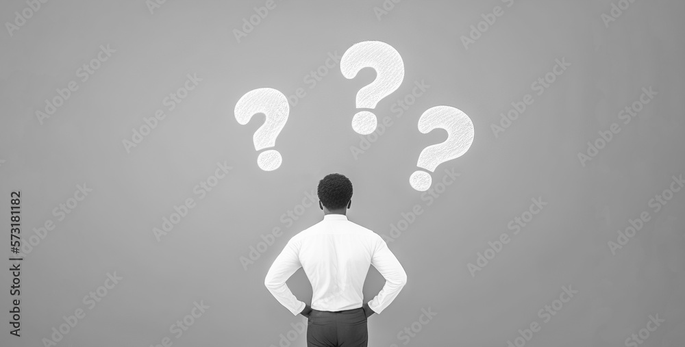 Questions, African American business man looking at questions marks ...