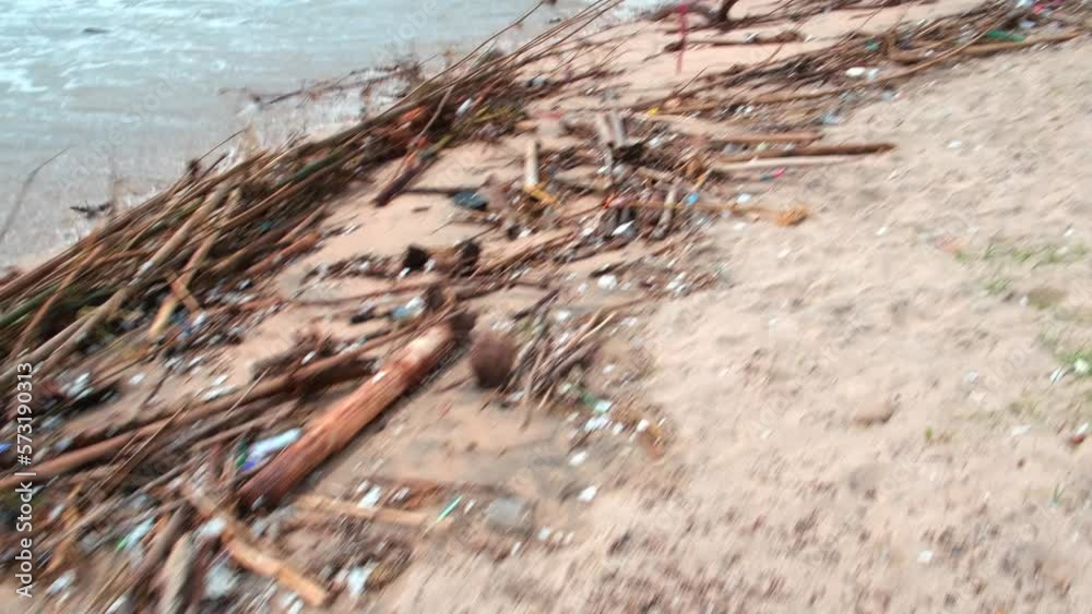 Tropical beach completely covered with garbage and waste. Ecological ...