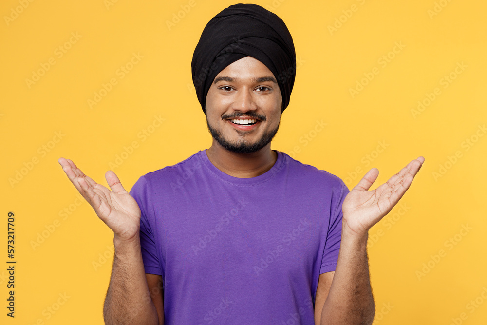 Surprised excited devotee Sikh Indian man ties his traditional turban ...