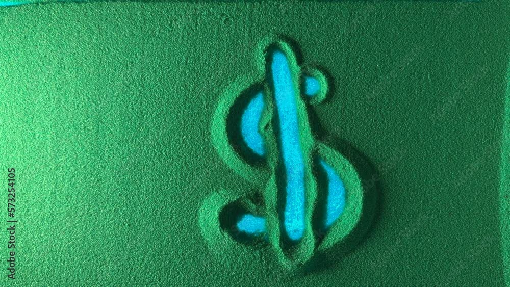 Hand drawing the Dollar currency symbol in the Green Sand. Male hand ...