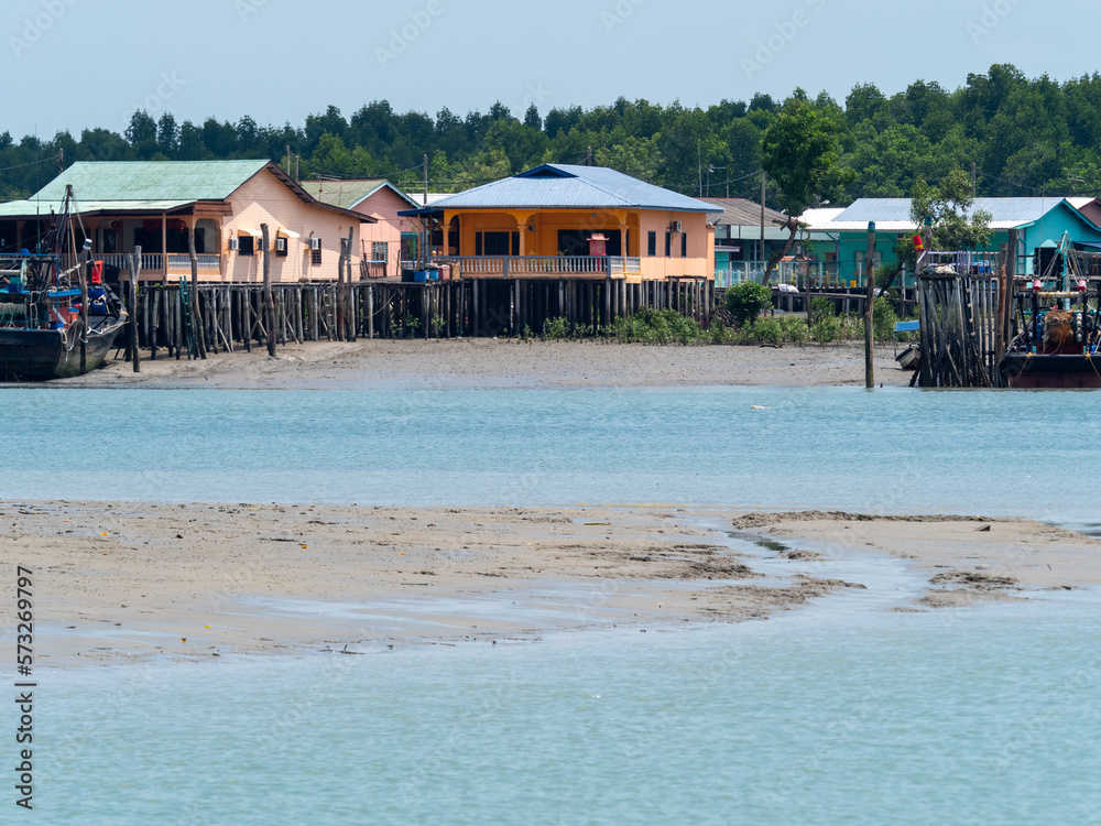 Stilt kampong houses during low tide in Pulau Ketam, Malaysia. Pulau ...