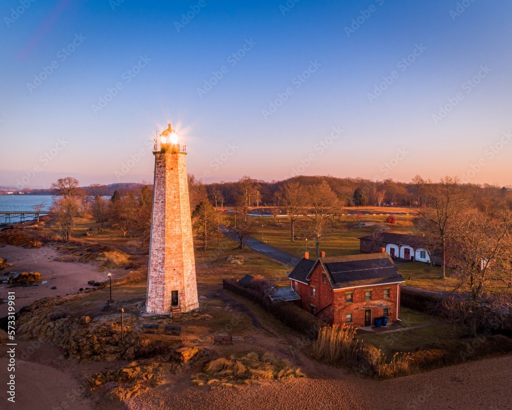 5-Mile Point Lighthouse at Sunrise with Reflecting Sun off Lighthouse ...