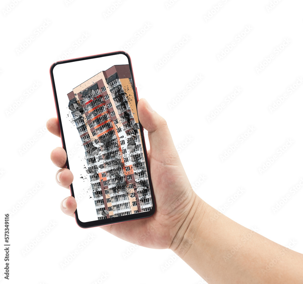 Earthquake. Disinformation. Destroyed building. Hand holding mobile ...