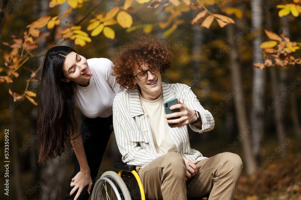 Funny, positive disabled guy and his girlfriend take a photo on the ...