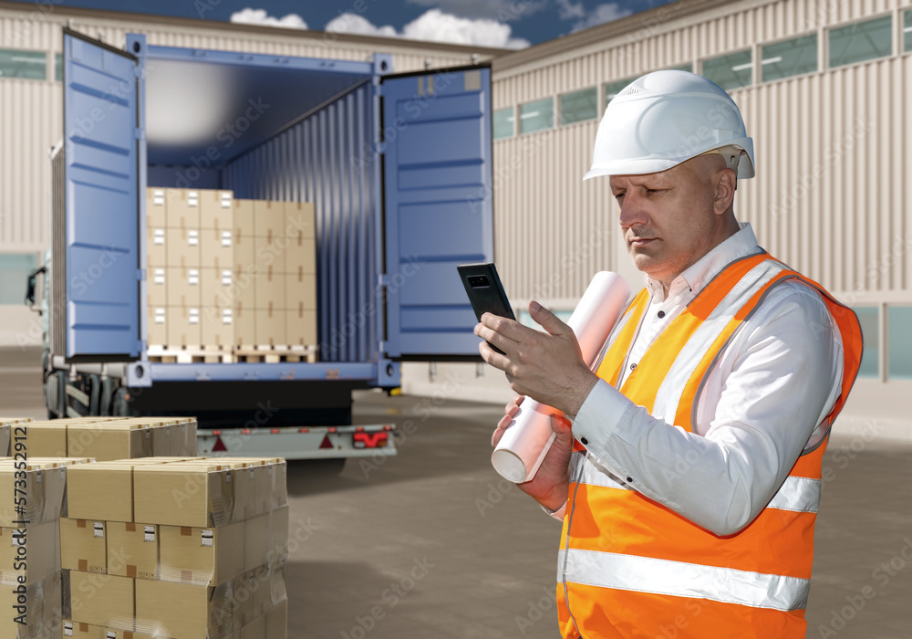 Logistics company specialist. Man with phone controls unloading of car ...