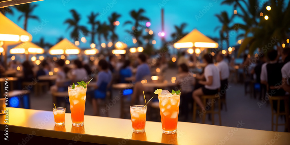Crowded night beach party in a beach bar. Variety of cocktails at bar ...