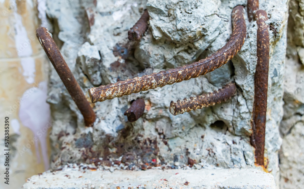 damaged reinforced concrete with exposed rusted steel resistance bars ...