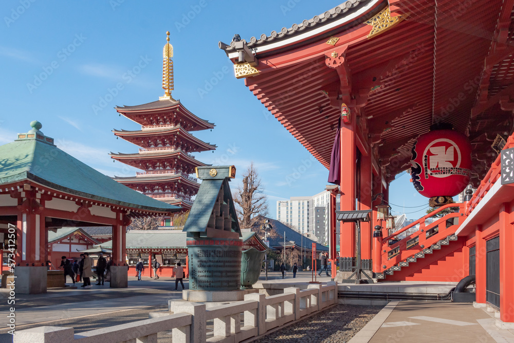 Famous tall pagoda and colorful red and green wood traditional Buddhist ...