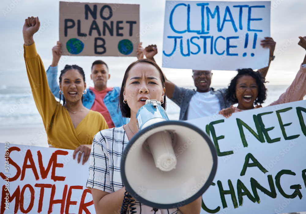 Climate change protest, megaphone and Asian woman with crowd at beach ...