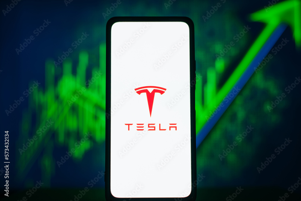 Tesla investment and trading financial concept. Tesla company logo on ...