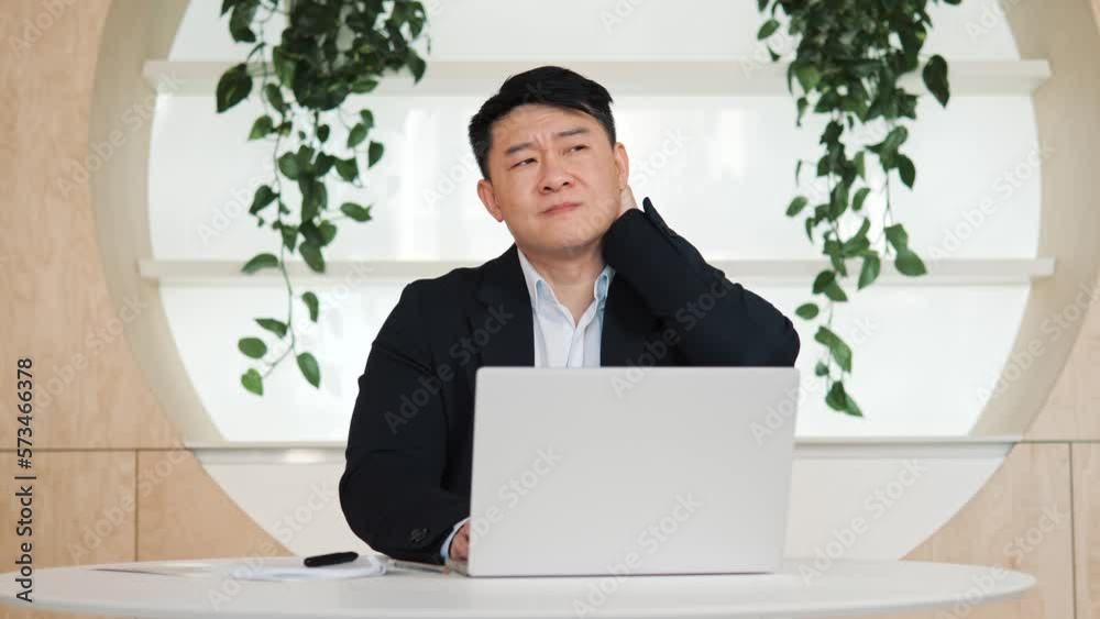 Portrait of adult Korean business man freelancer sitting in office ...