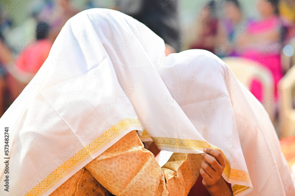 Foto de Father and Son under cover, under veil for Upanayana Ceremony ...