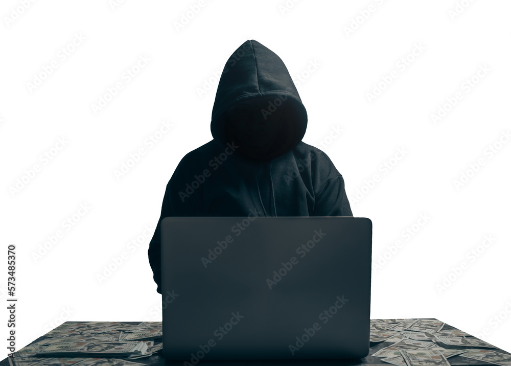 anonymous young man hacker sitting playing laptop with lots of money ...