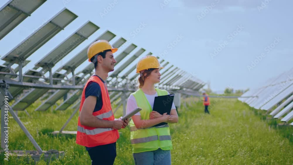 Standing in front of the camera two ecological engineers lady and man ...