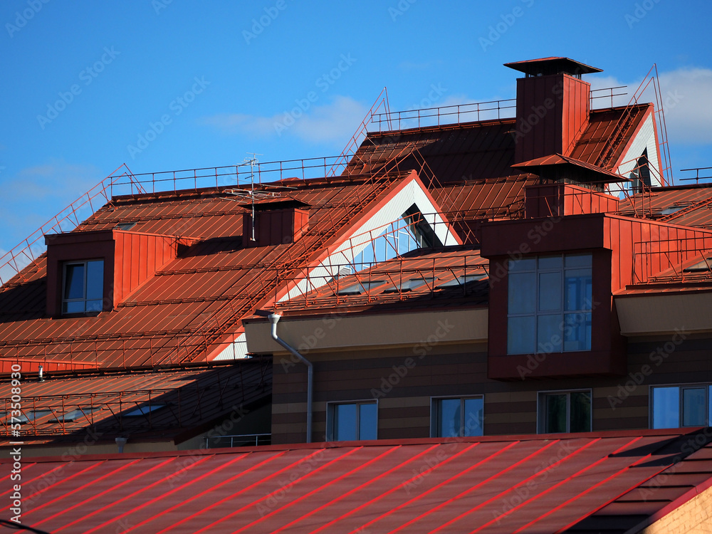 The pitched roofs of the houses are covered with roofing iron. The ...