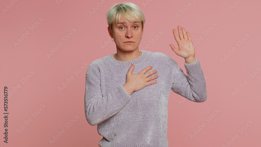 I swear to be honest. Sincere responsible young woman raising hand to ...