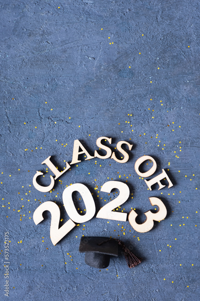 Class of 2023 concept. Wooden number 2023 with graduate hat on dark ...