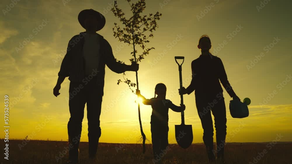 concept mother child go plant tree ground. happy family life concept ...