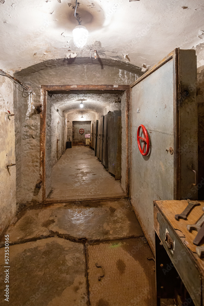 Hermetic rusty door of the bunker in underground abandoned tunnel ...