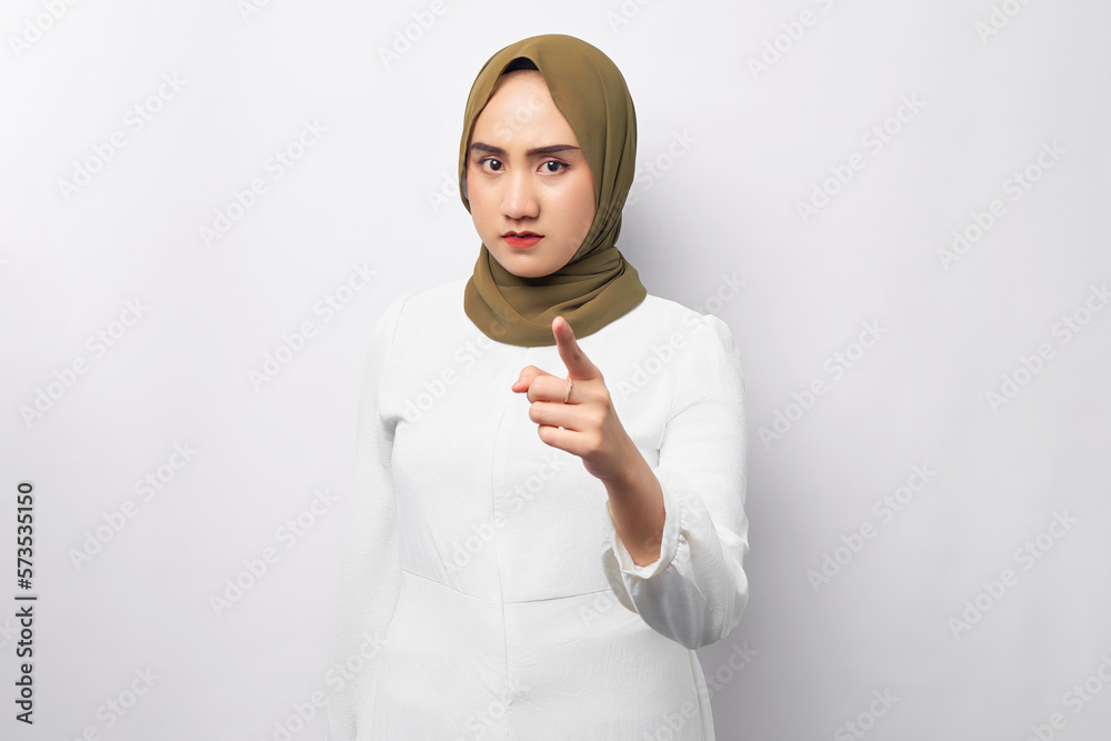 Angry young beautiful Asian Muslim woman 20s wearing hijab points her ...