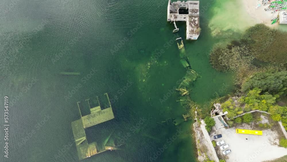 Village flooded and submerged underwater. Abandoned Rummu quarry ...