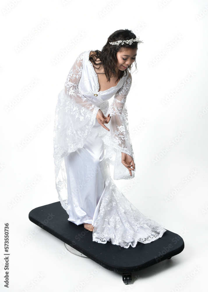Full length portrait of beautiful woman wearing fantasy costume, white ...