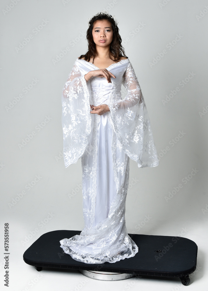 Full length portrait of beautiful woman wearing fantasy costume, white ...