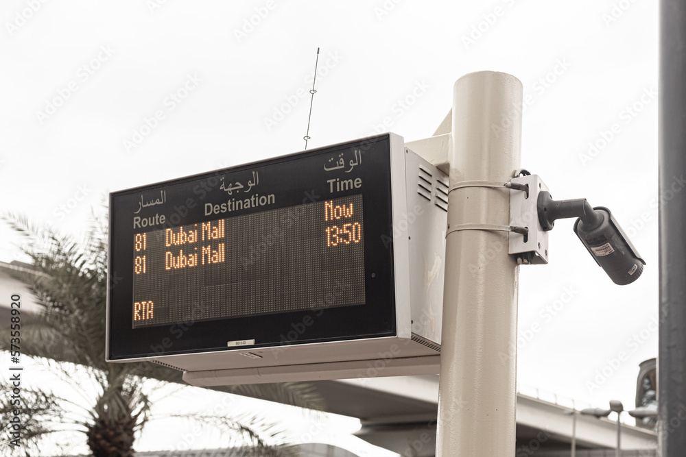Digital Information panel with bus departure times in Dubai. A bus to ...