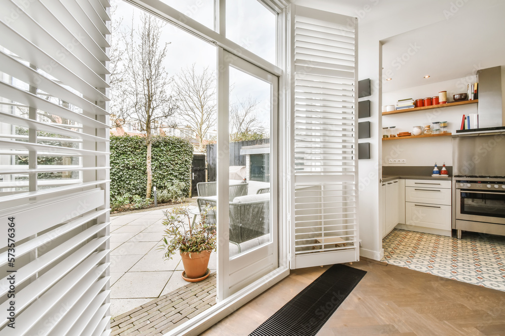 Modern kitchen interior with furniture and open door Stock Photo ...
