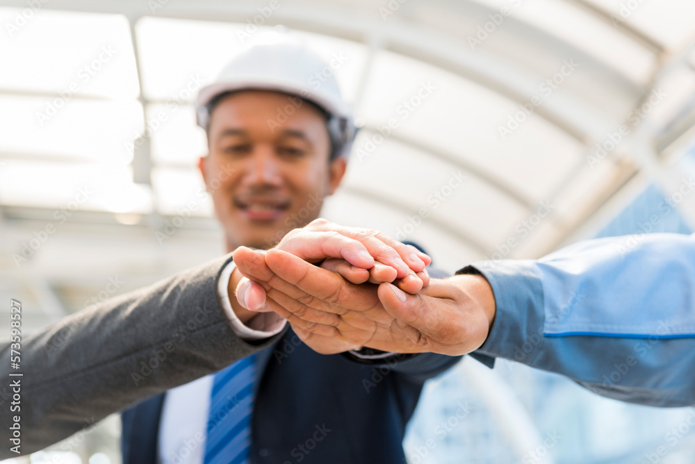 Group of Engineer United stack hands or join hand teamwork together ...