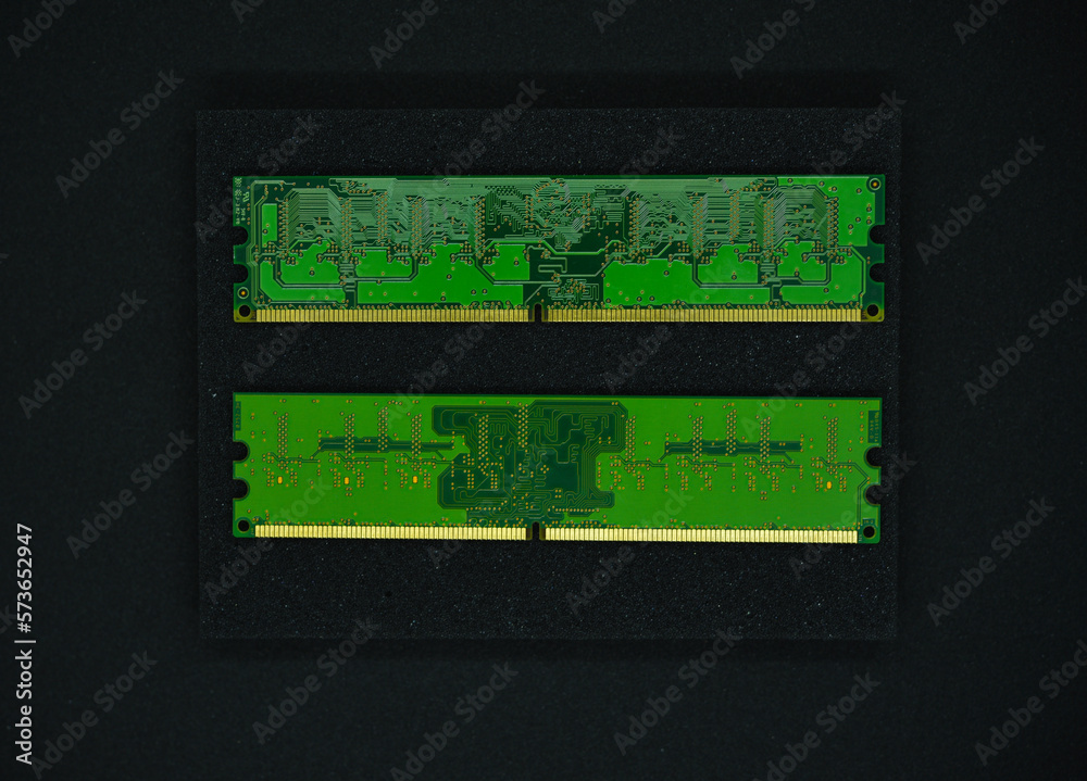 Green RAM strips on black foam. Computer chips close-up. Microchips and ...