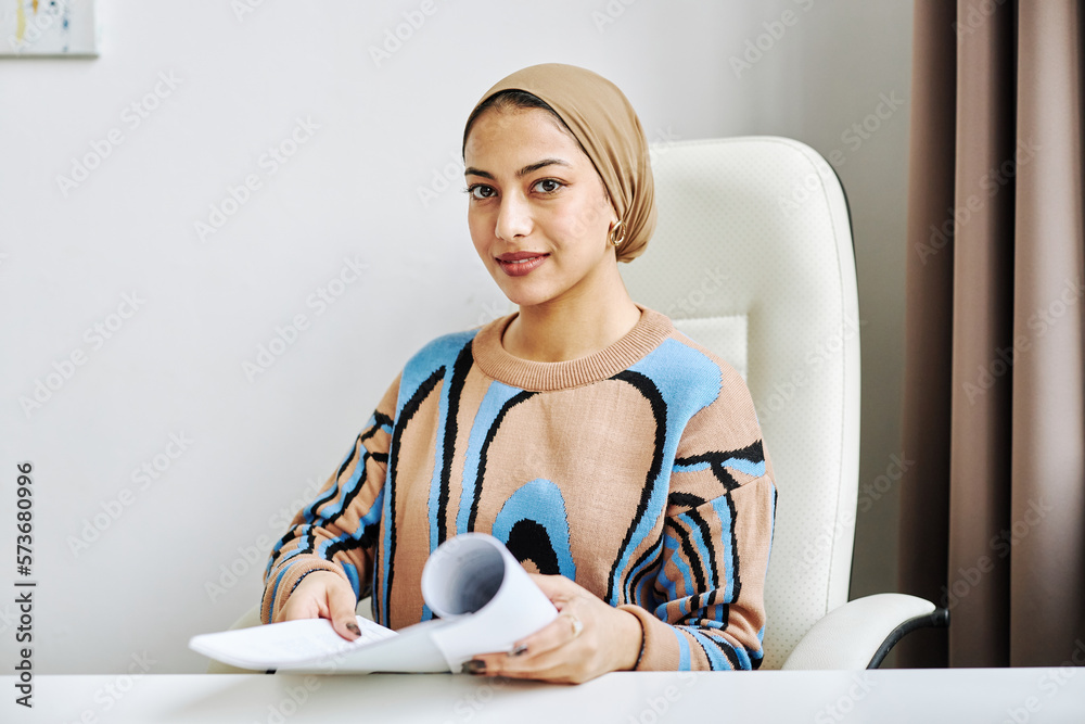 Minimal portrait of young Middle Eastern woman as female boss looking ...