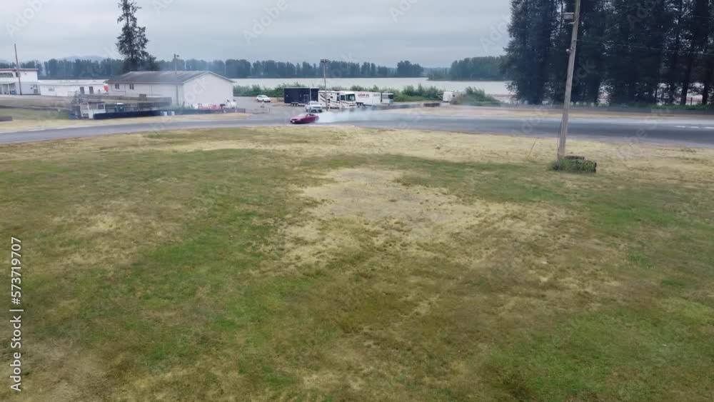 Red Drift Car / Race car drifting around corner very fast with lots of ...