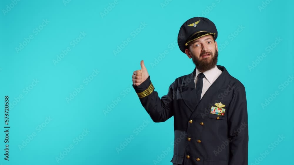 Aircrew captain pointing to left or right sides in studio, indicating ...