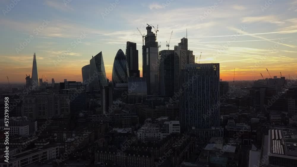Golden sunrise over London, UK showing Shard and Gherkin high-rises ...